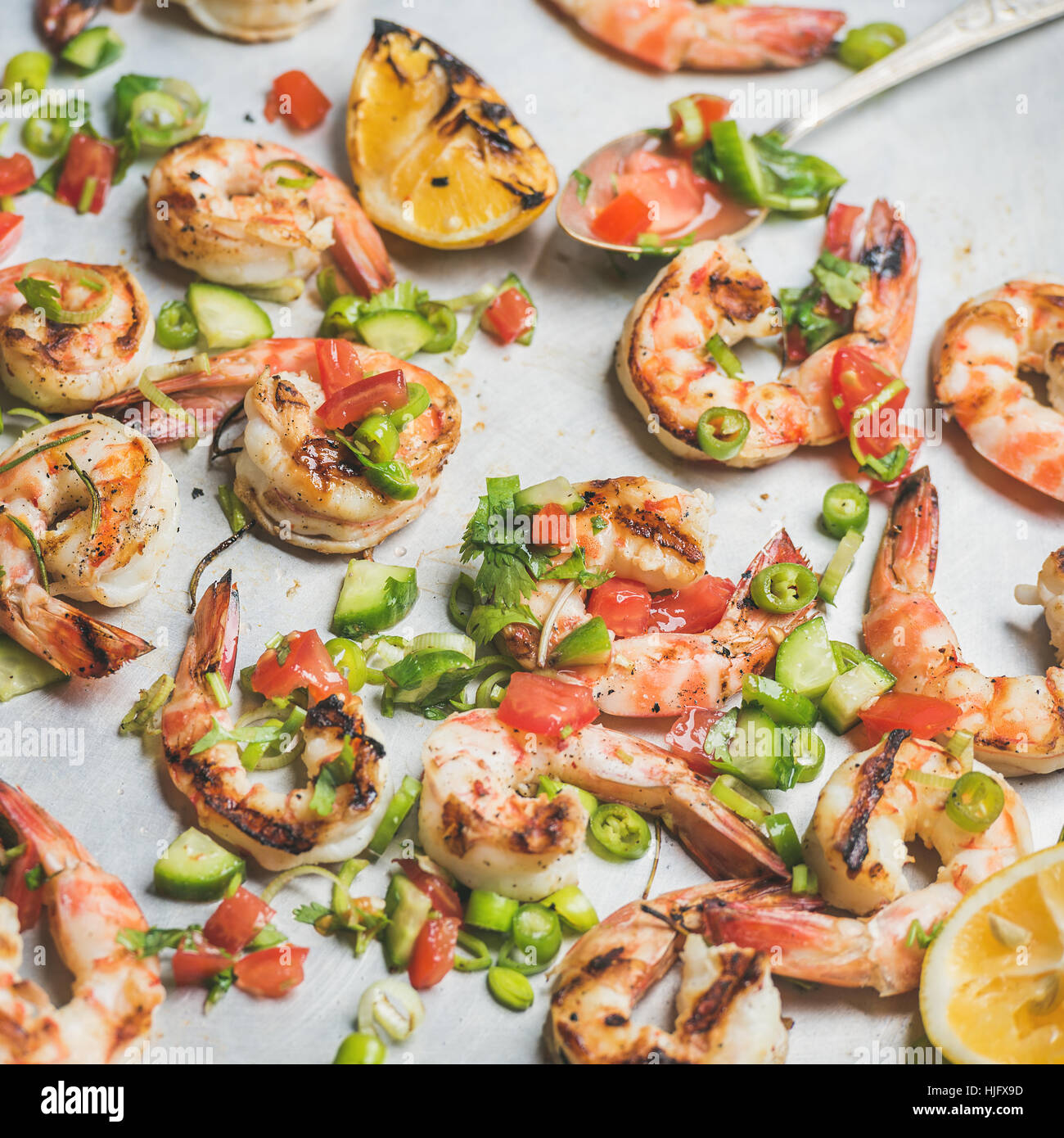Close-up of grilled tiger prawns over white background, square crop ...