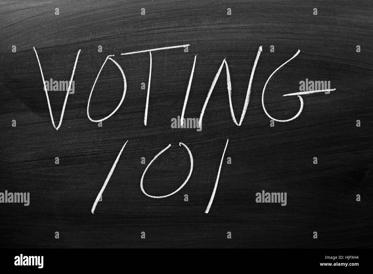 Voting 101 On A Blackboard Stock Photo - Alamy