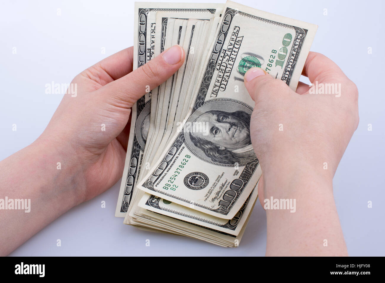 Human hand holding American dollar bill as money isolated on white ...