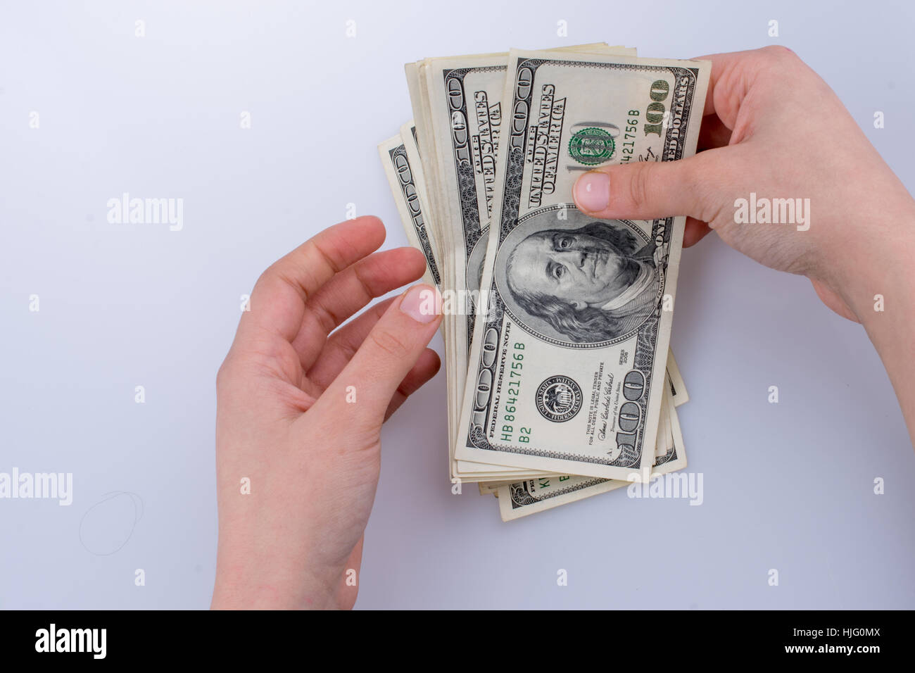Human hand holding American dollar bill as money isolated on white ...