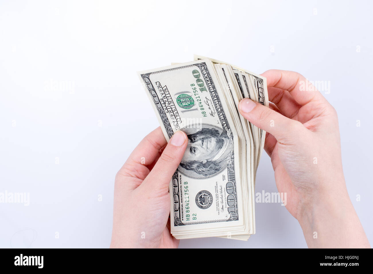 Human hand holding American dollar bill as money isolated on white ...