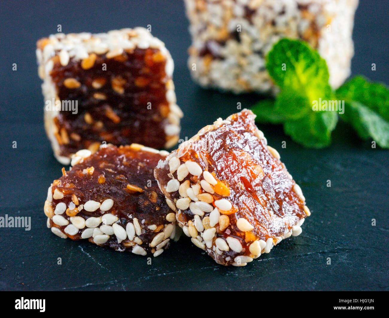 Turkish delight slice on black rustic background. Traditional turkish ...