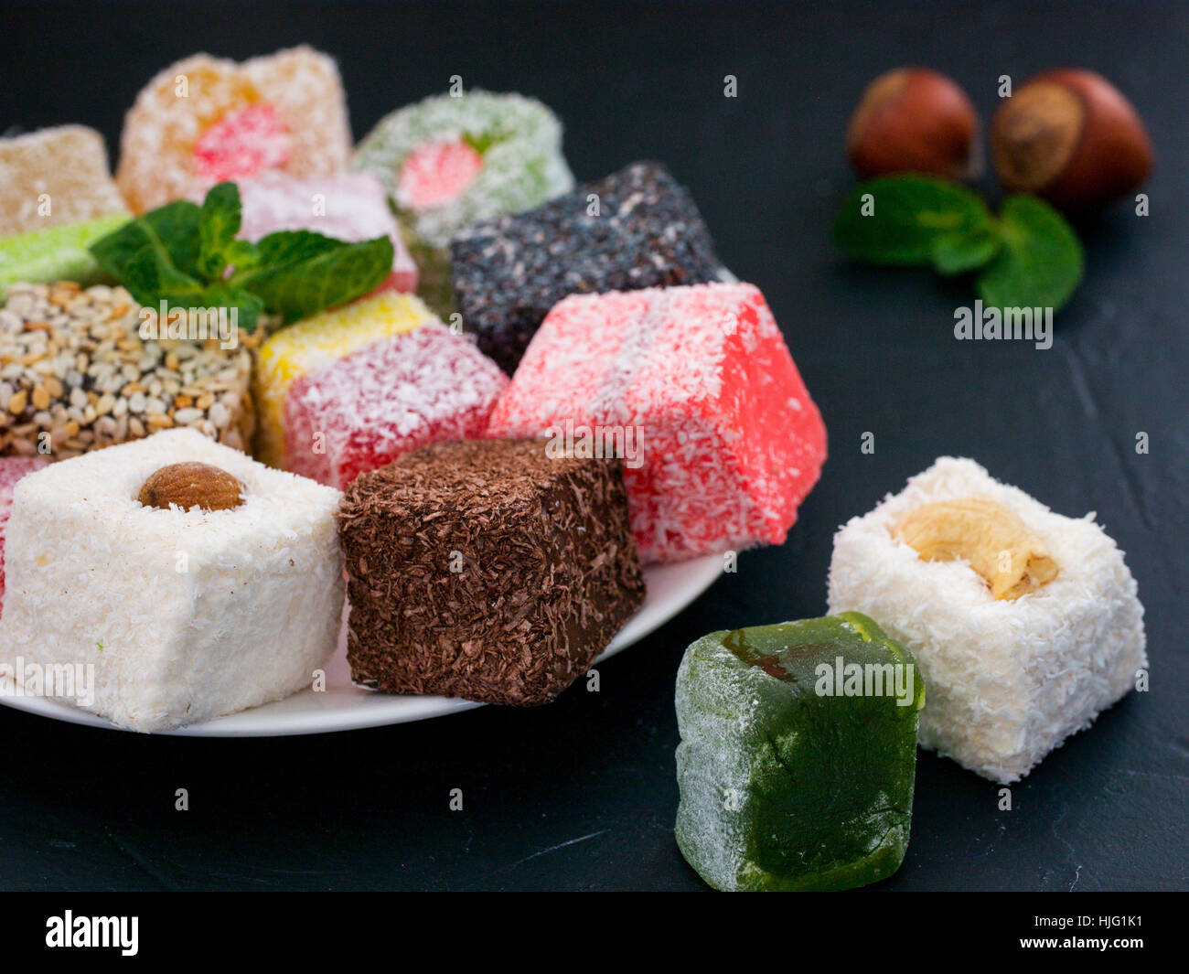 Turkish delight on black rustic background. Turkish deligh set ...