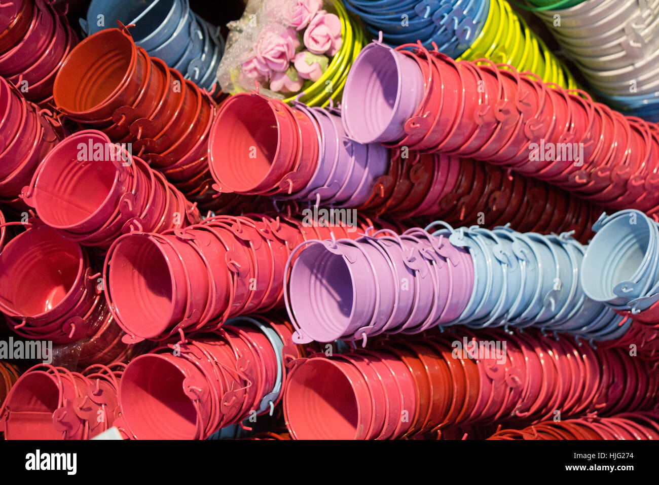 Little set of buckets of various colors in a market place Stock Photo ...
