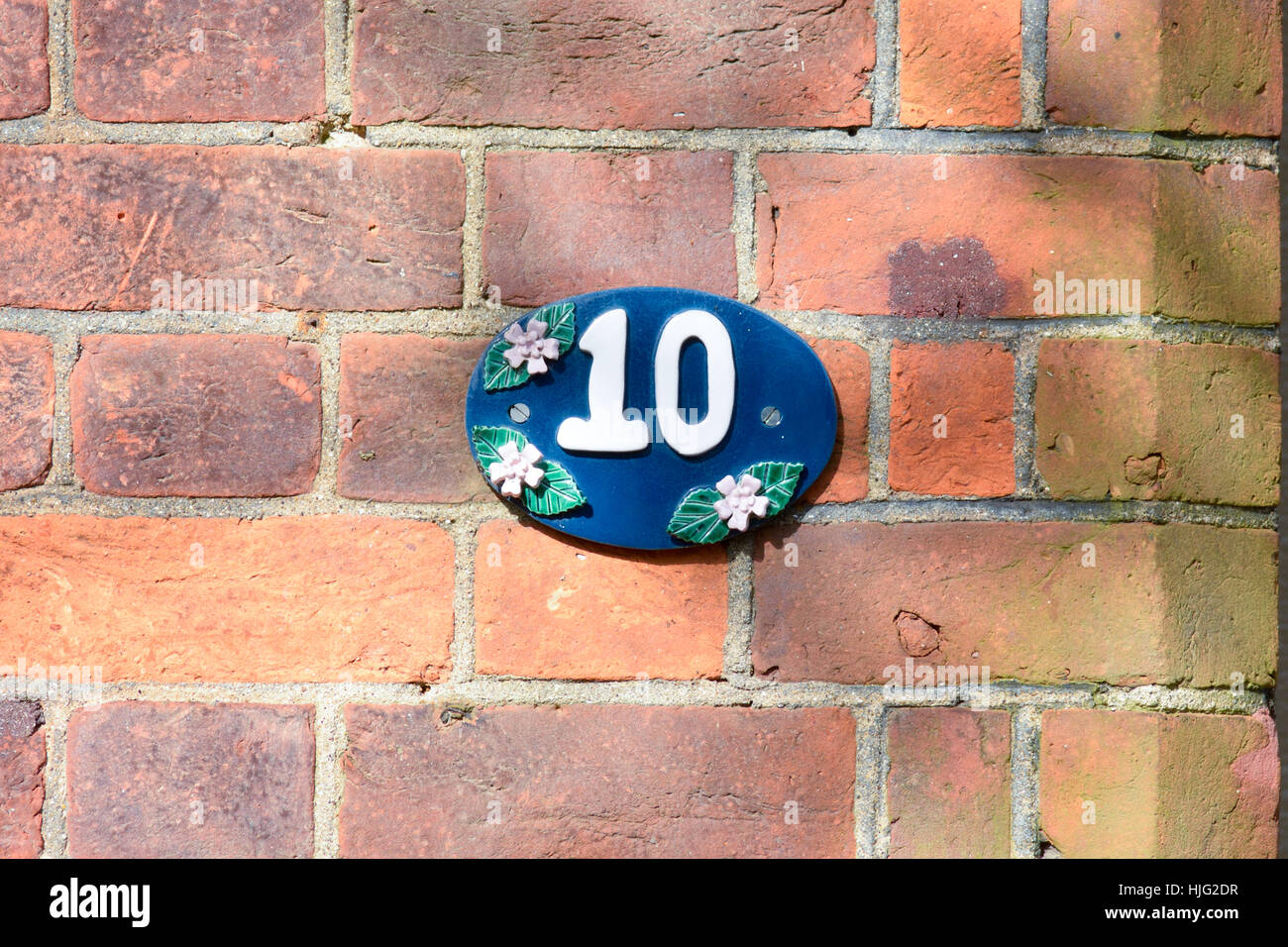 House number 10 sign fixed to wall Stock Photo - Alamy