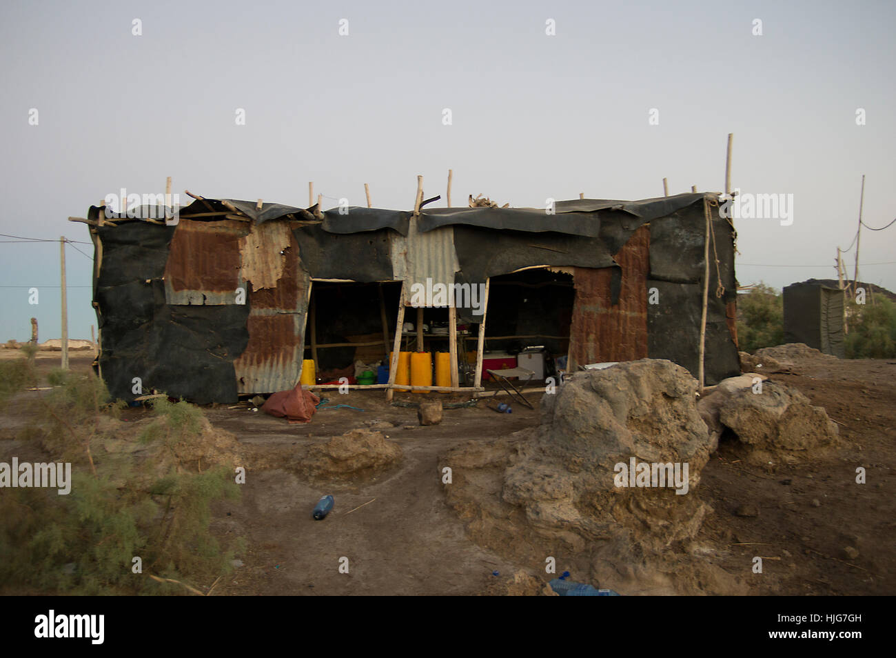 Tin, leather hide, wood, paper shack in the desert of the Danakil ...