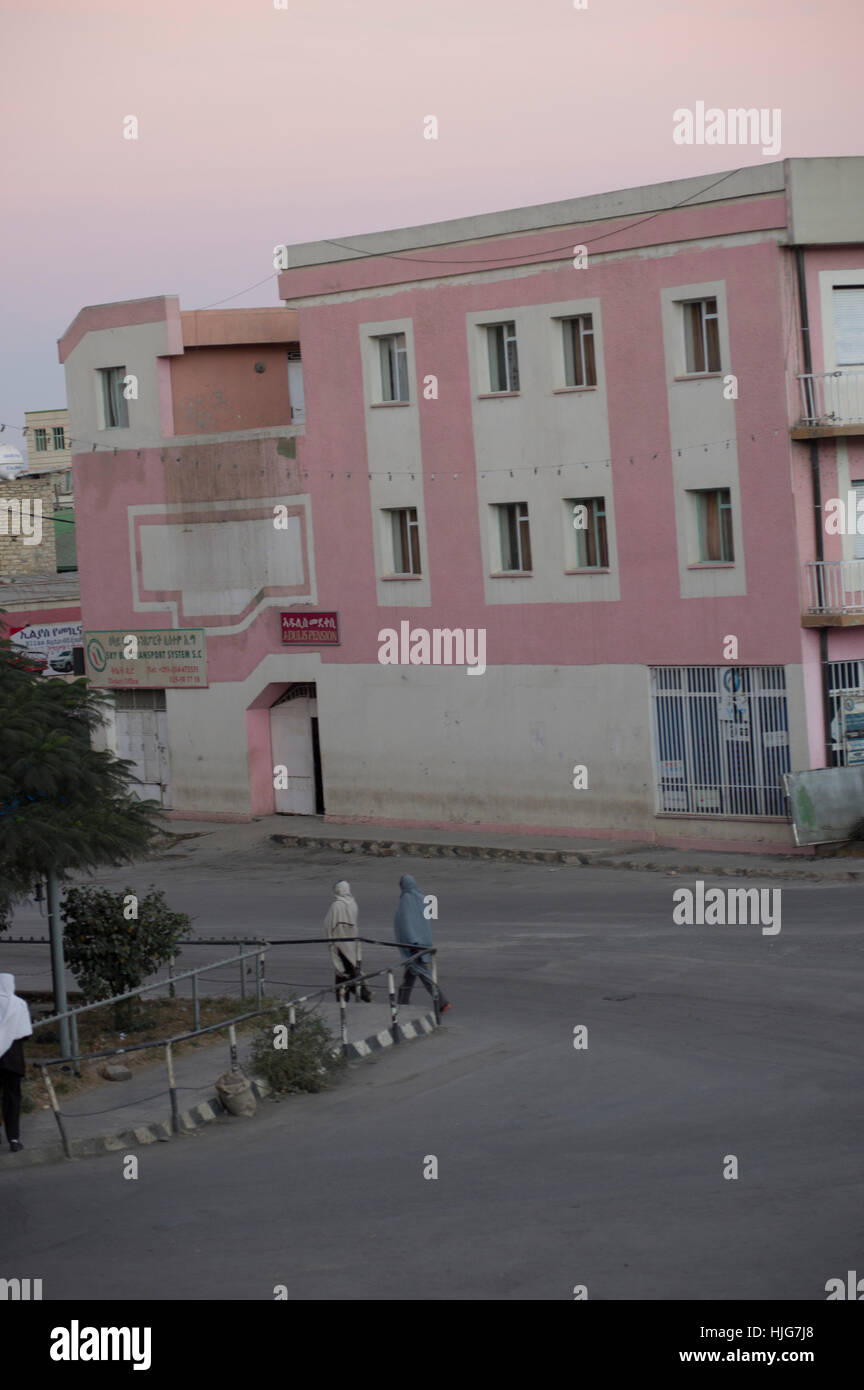 Two people walking in the street in Mekelle, Ethiopia, with a large ...
