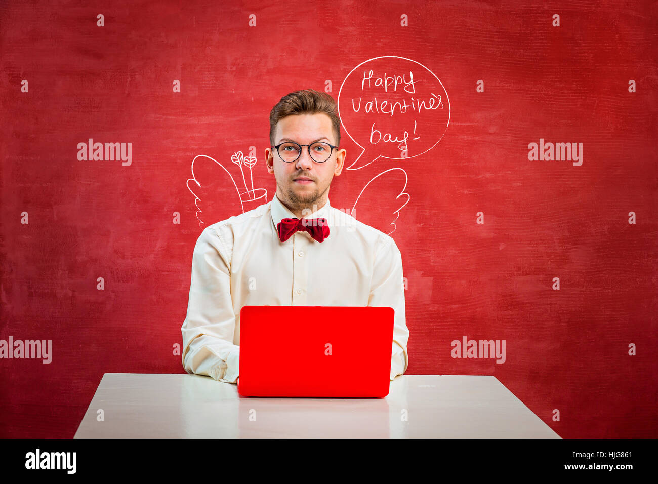 Young funny man with laptop at St. Valentine's Day Stock Photo - Alamy