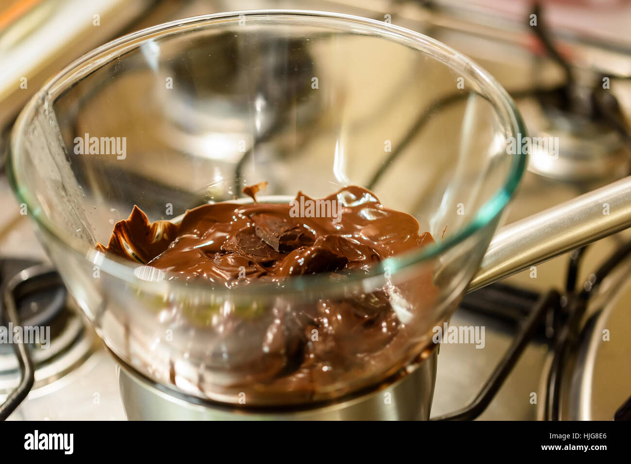Melting chocolate stove hi-res stock photography and images - Alamy