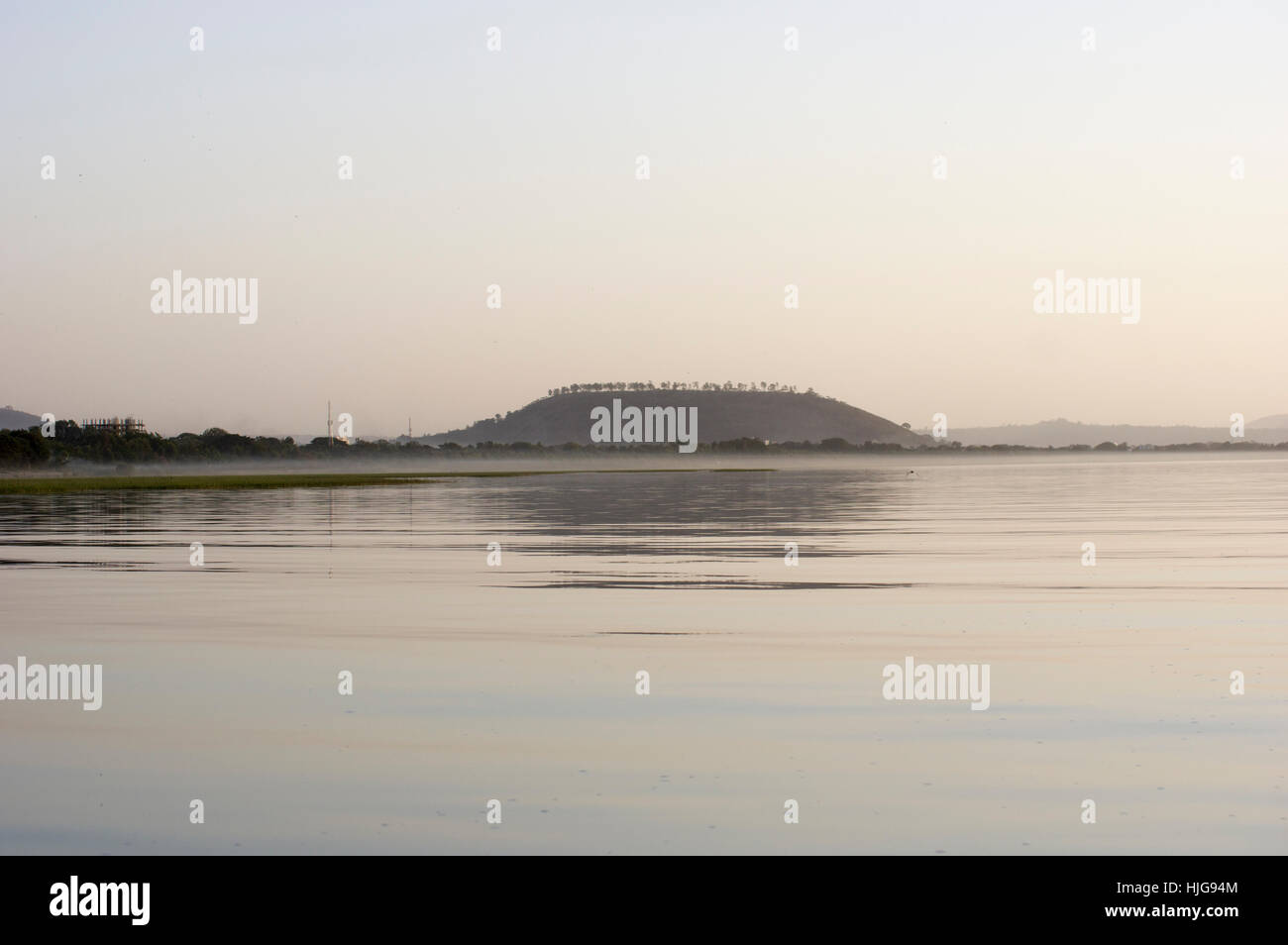 Peaceful sunset at Lake Hawassa in Ethiopia, volcanic mountain with a ...