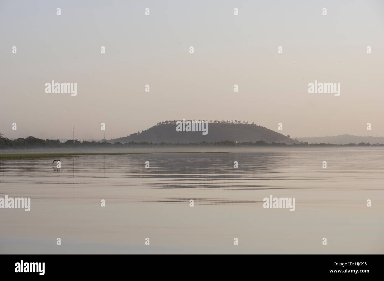 Peaceful sunset at Lake Hawassa in Ethiopia, volcanic mountain with a ...