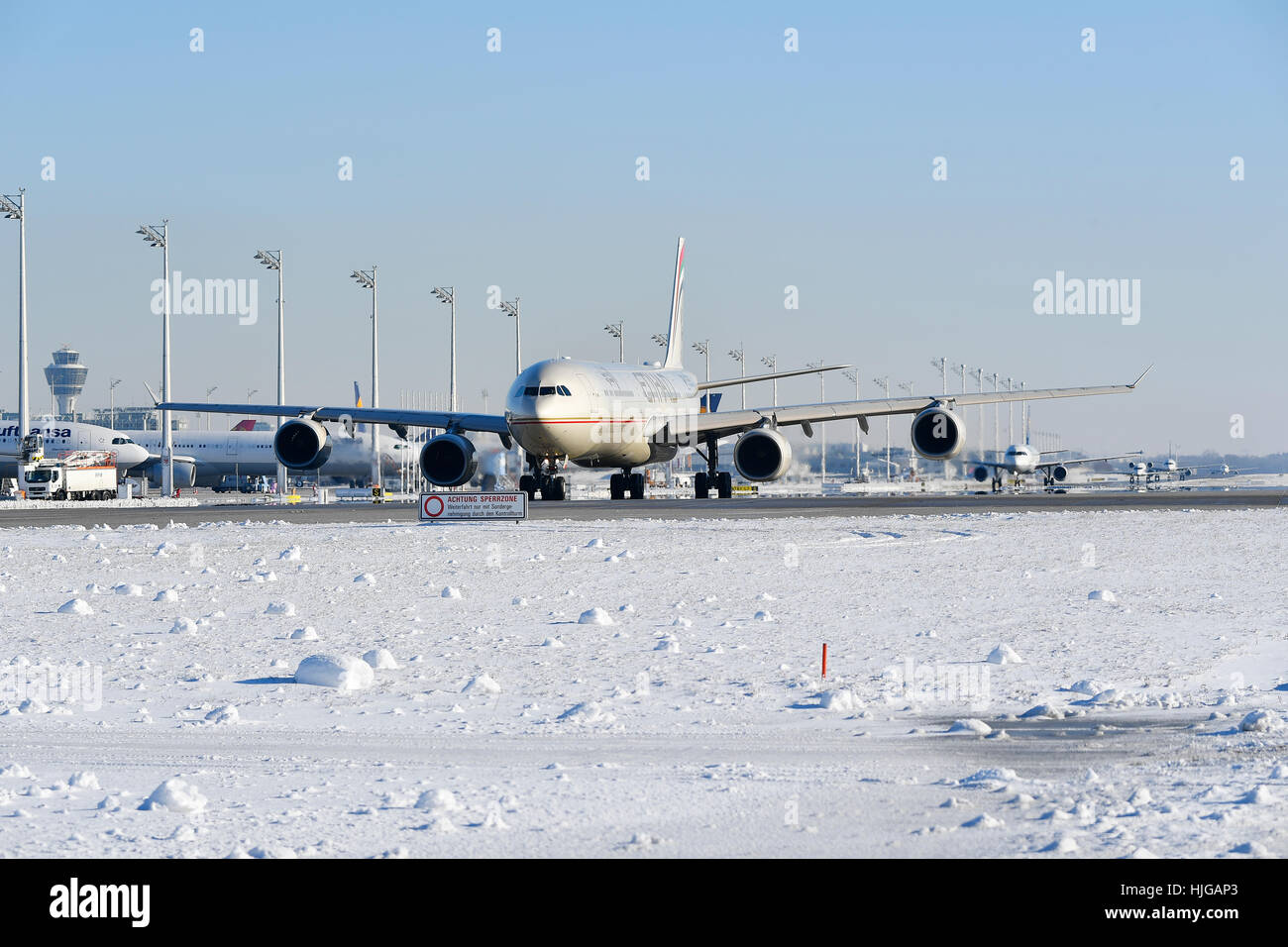Aircraft on snowy runway, Etihad Airlines, Airbus A 340, Munich Airport ...