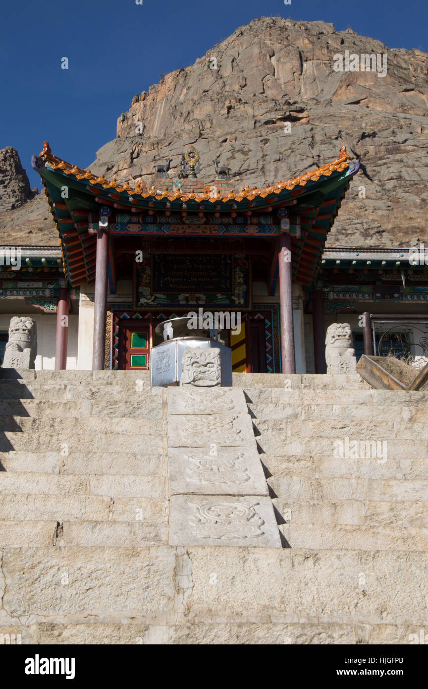 Exterior of Buddhist temple with stone steps leading to main entry that ...