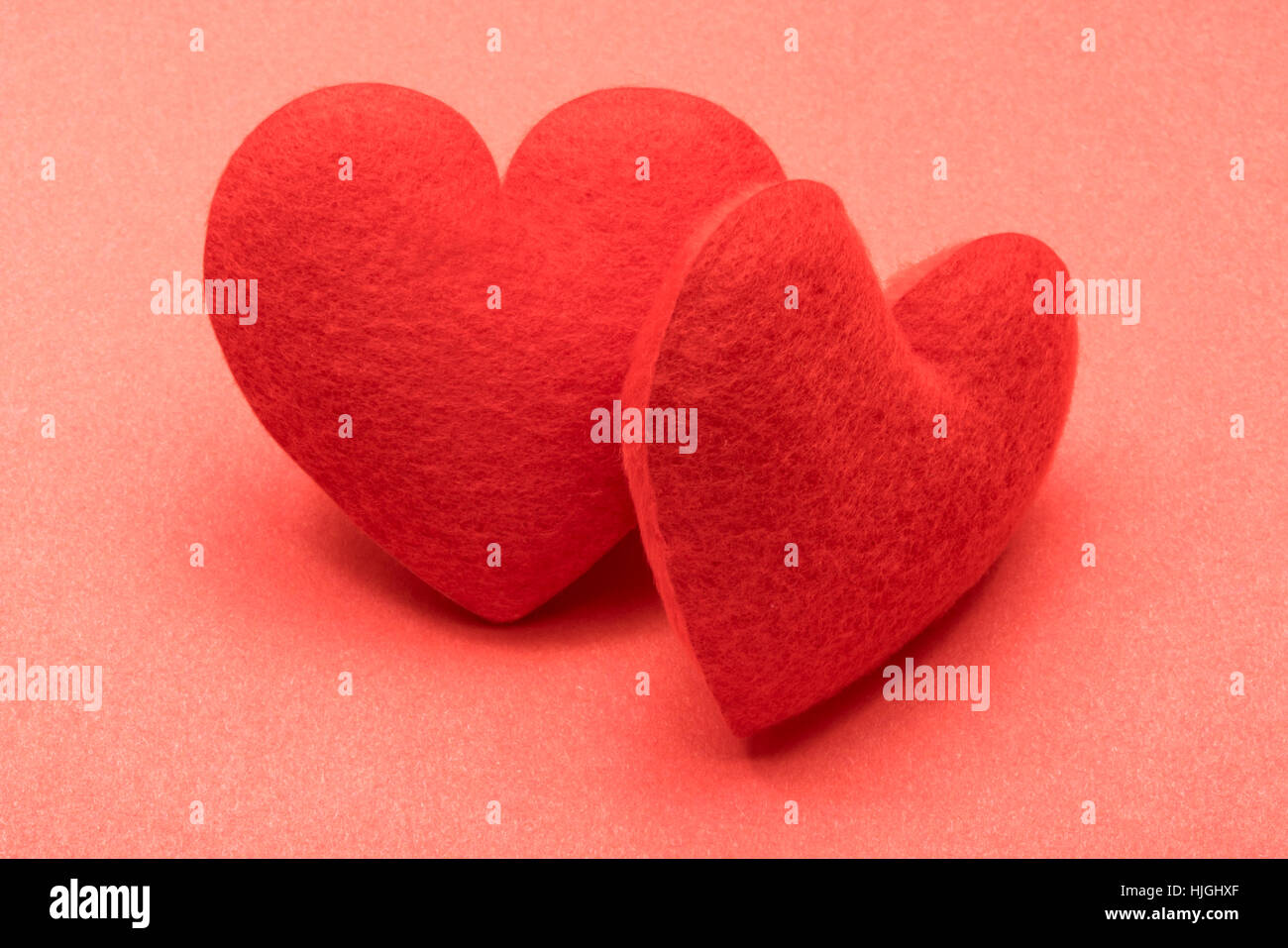 Two red heart on pink background are symbol of couple lovers Stock ...