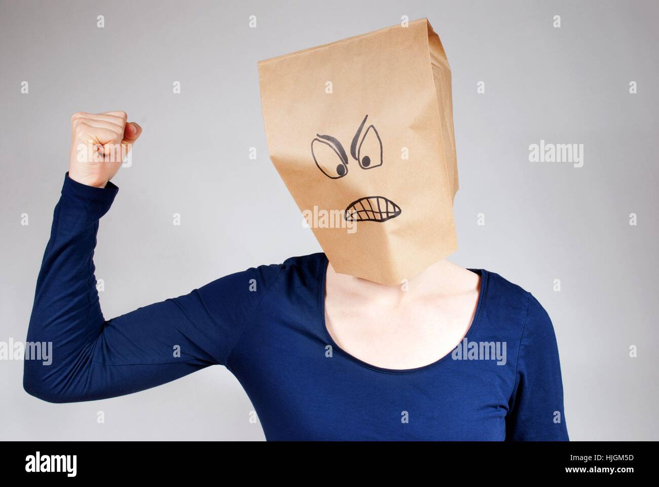 a angry person with bad smiley on paper bag head Stock Photo - Alamy