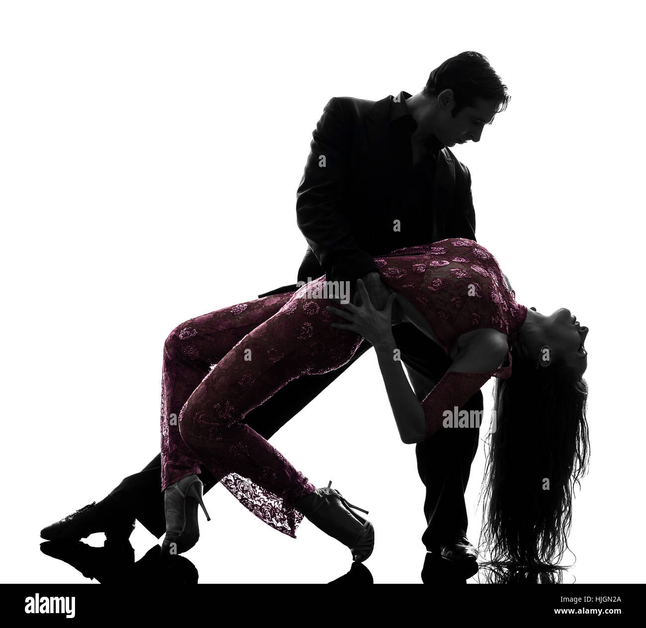 one caucasian couple man woman ballroom dancers tangoing in silhouette ...