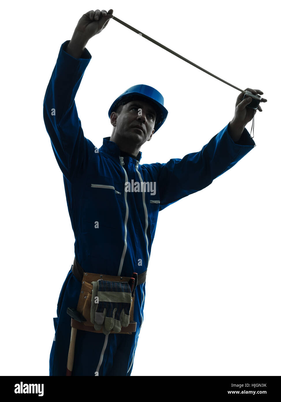 one caucasian man construction worker Tape Measure silhouette in studio ...