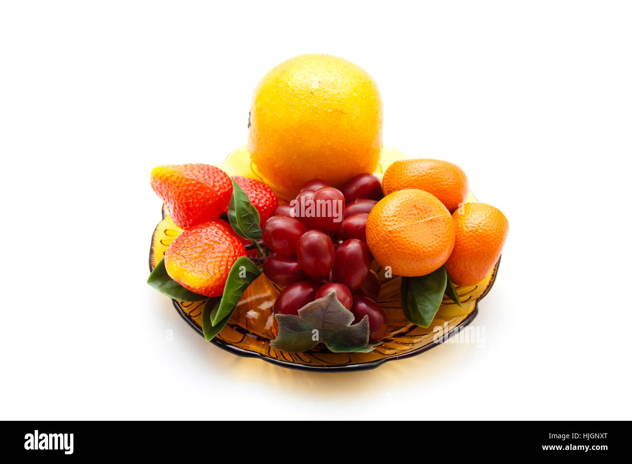 plastic fruit on glass plate Stock Photo - Alamy