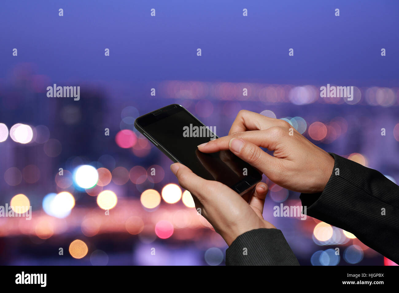 Hand smartphone on blurred hi-res stock photography and images - Alamy