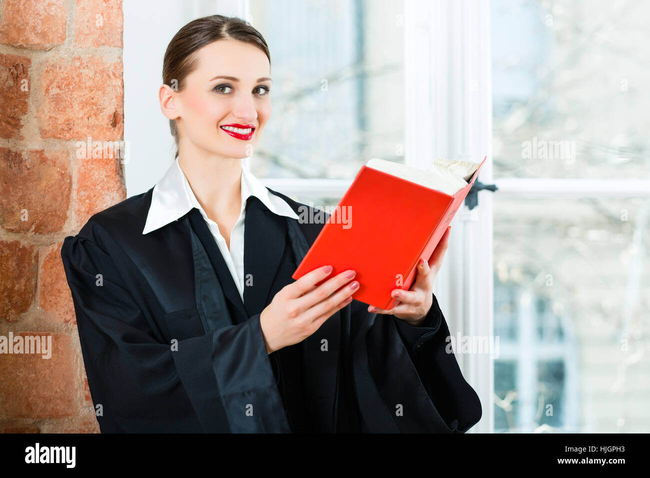 attorney in law firm reads the statute book Stock Photo - Alamy
