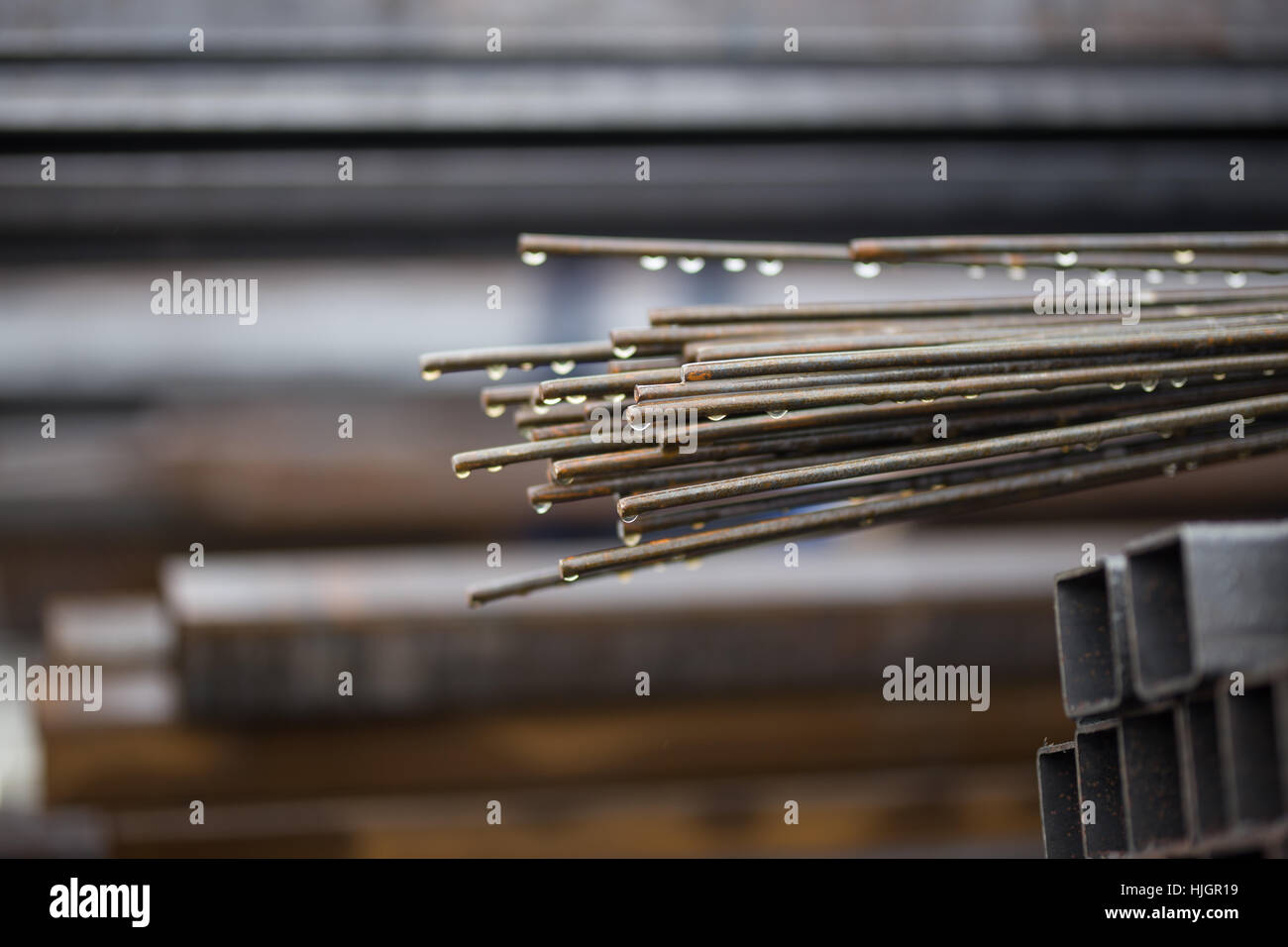 Rust steel rod or bars in outdoor warehouse Stock Photo - Alamy