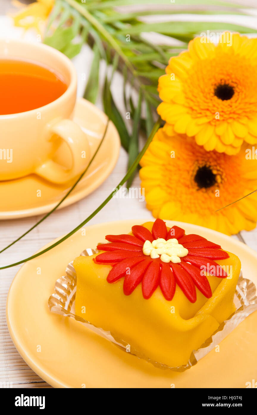 tea with cake and gerberas flowers Stock Photo - Alamy