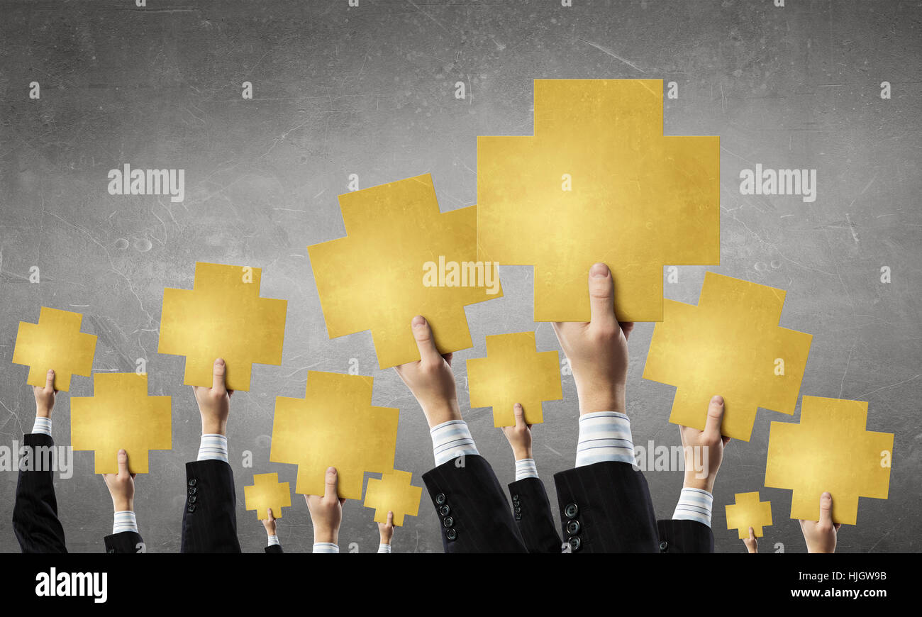 Many hands of business people holding plus signs hi-res stock ...