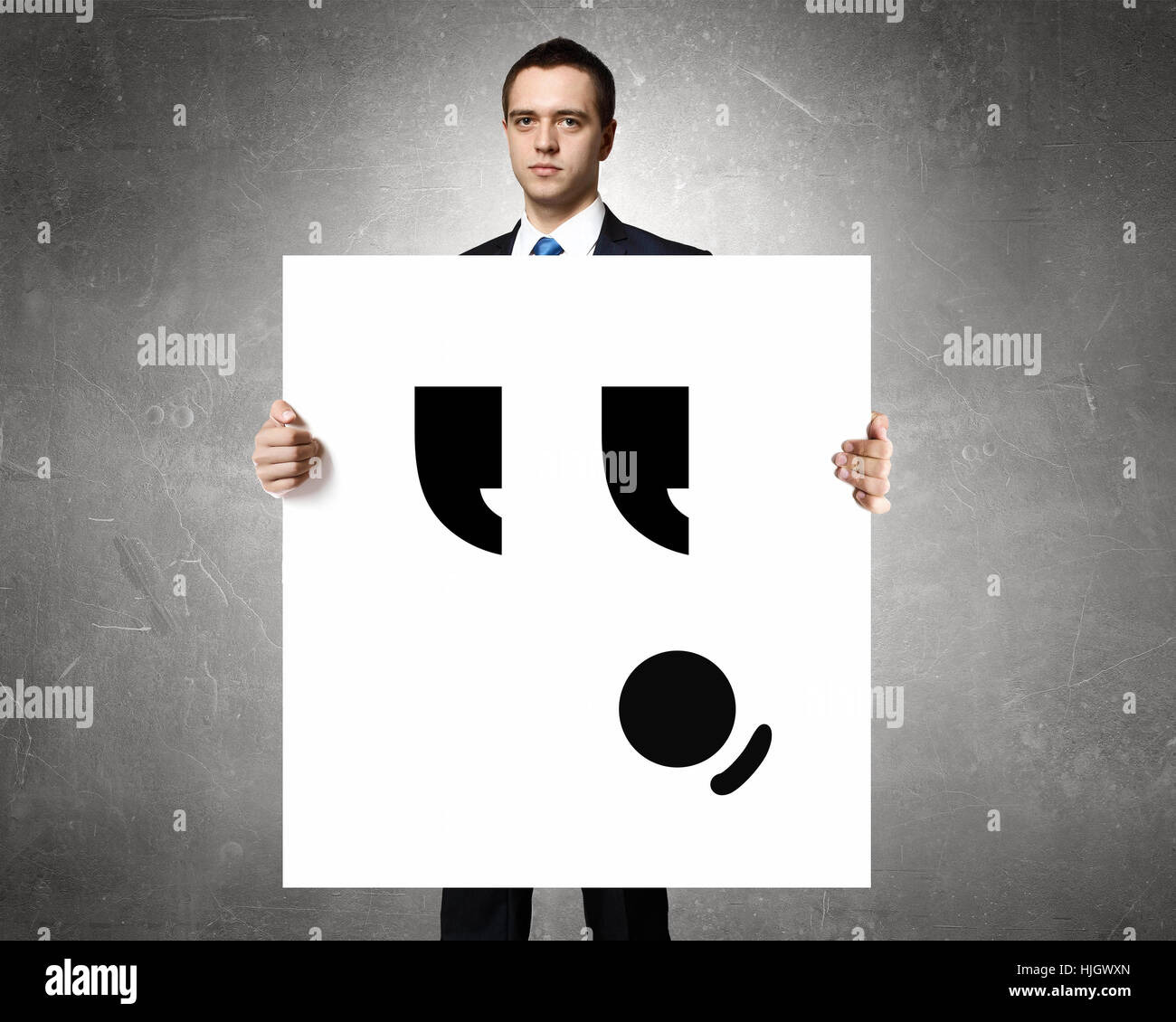 Businessman hold white board with sad face emoticon hi-res stock ...