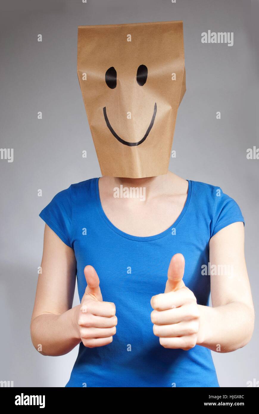 a happy anonymous person holding thumbs up Stock Photo - Alamy
