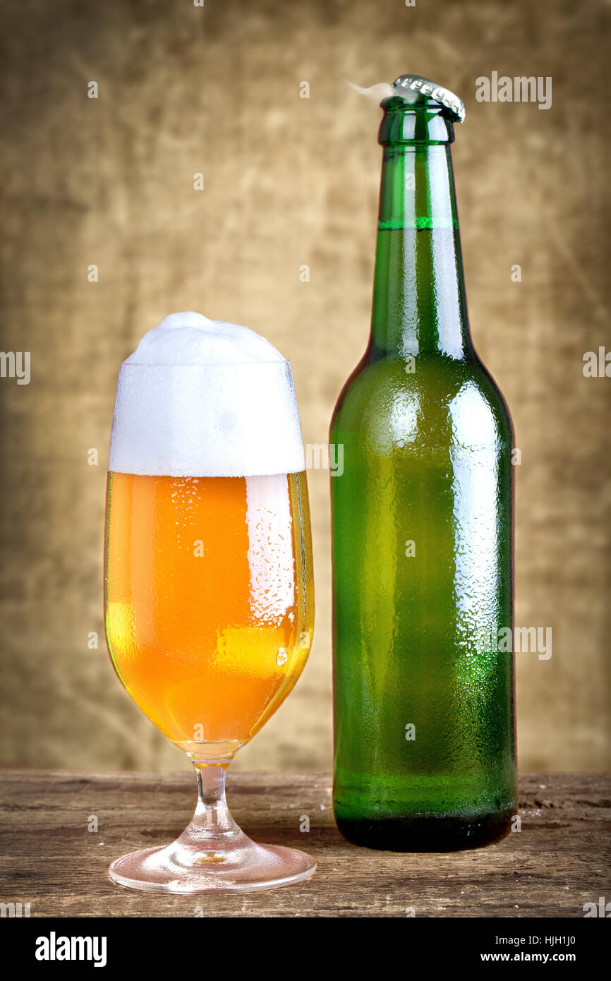 cool fresh beer with rustic background Stock Photo - Alamy