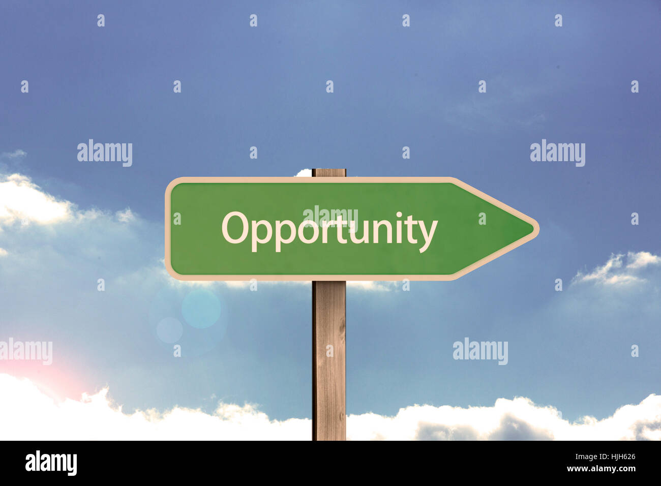 Opportunity road sign with blue sky behind Stock Photo - Alamy