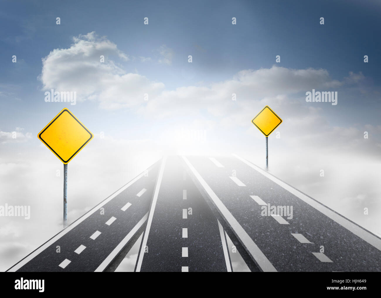 Road over clouds with road signs on it with bright blue sky Stock Photo ...