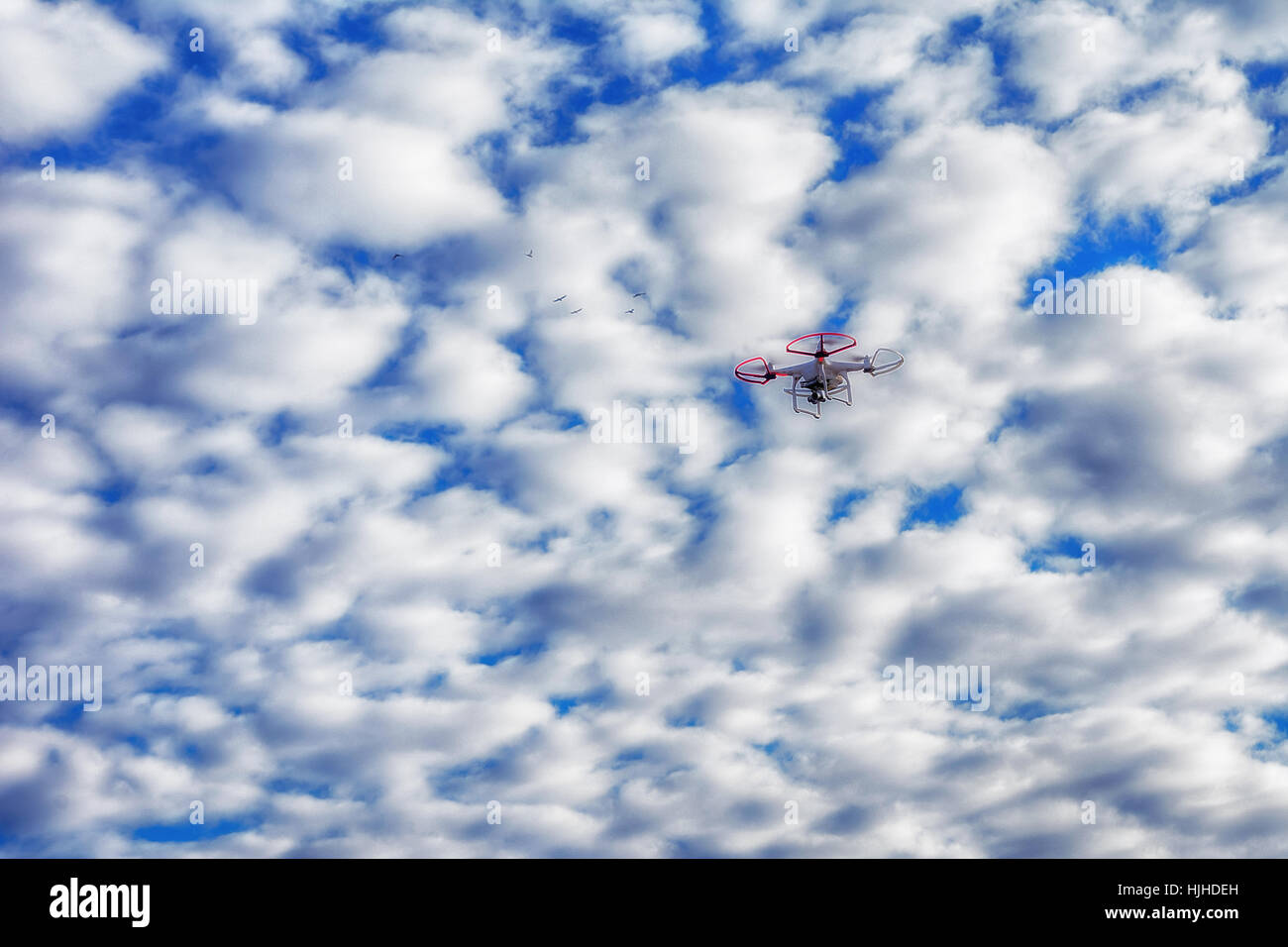 Drone flying on the sky background Stock Photo - Alamy