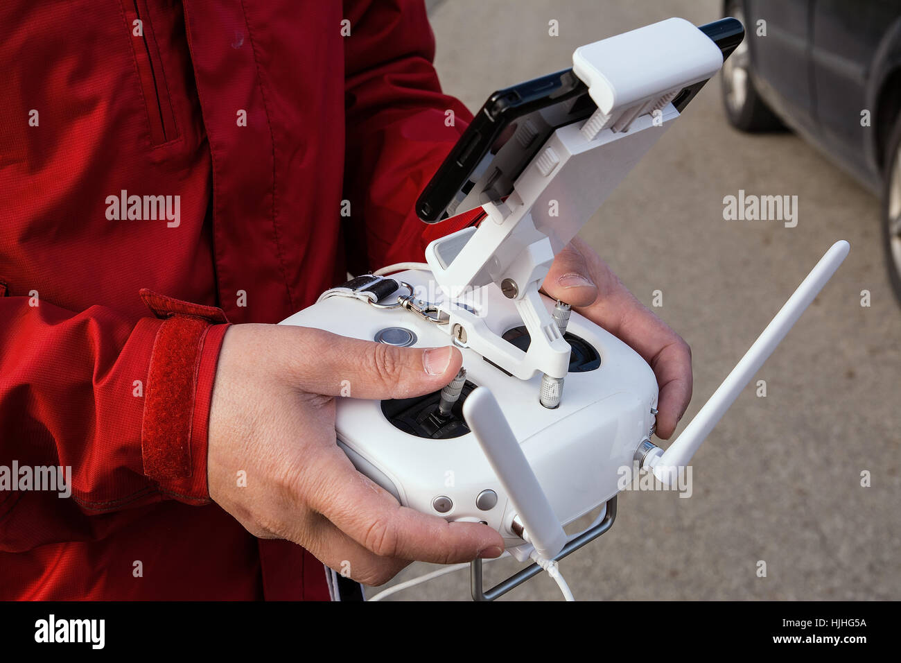 Man use remote control to controls the drone Stock Photo - Alamy