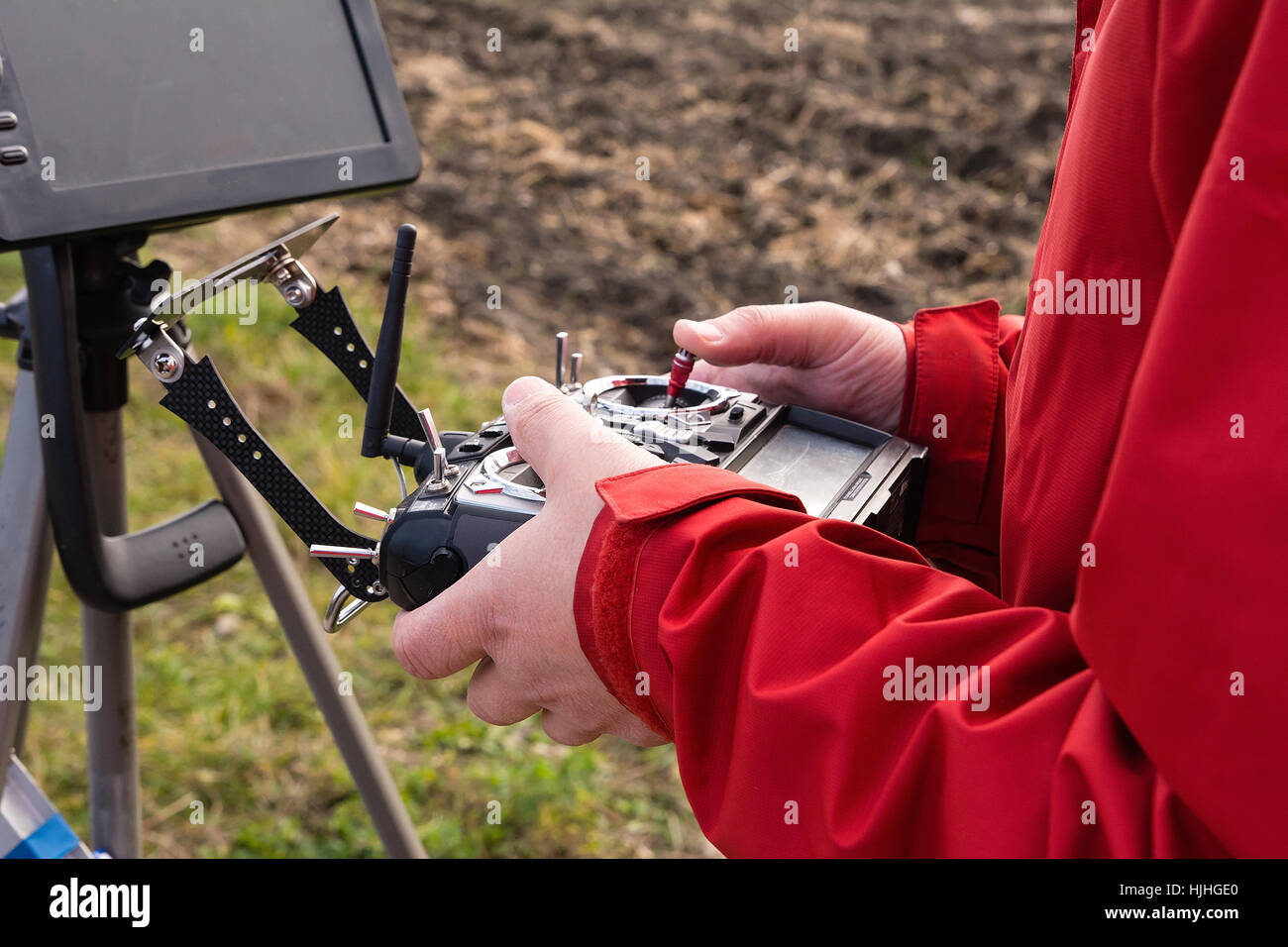 Man use remote control to controls the drone Stock Photo - Alamy