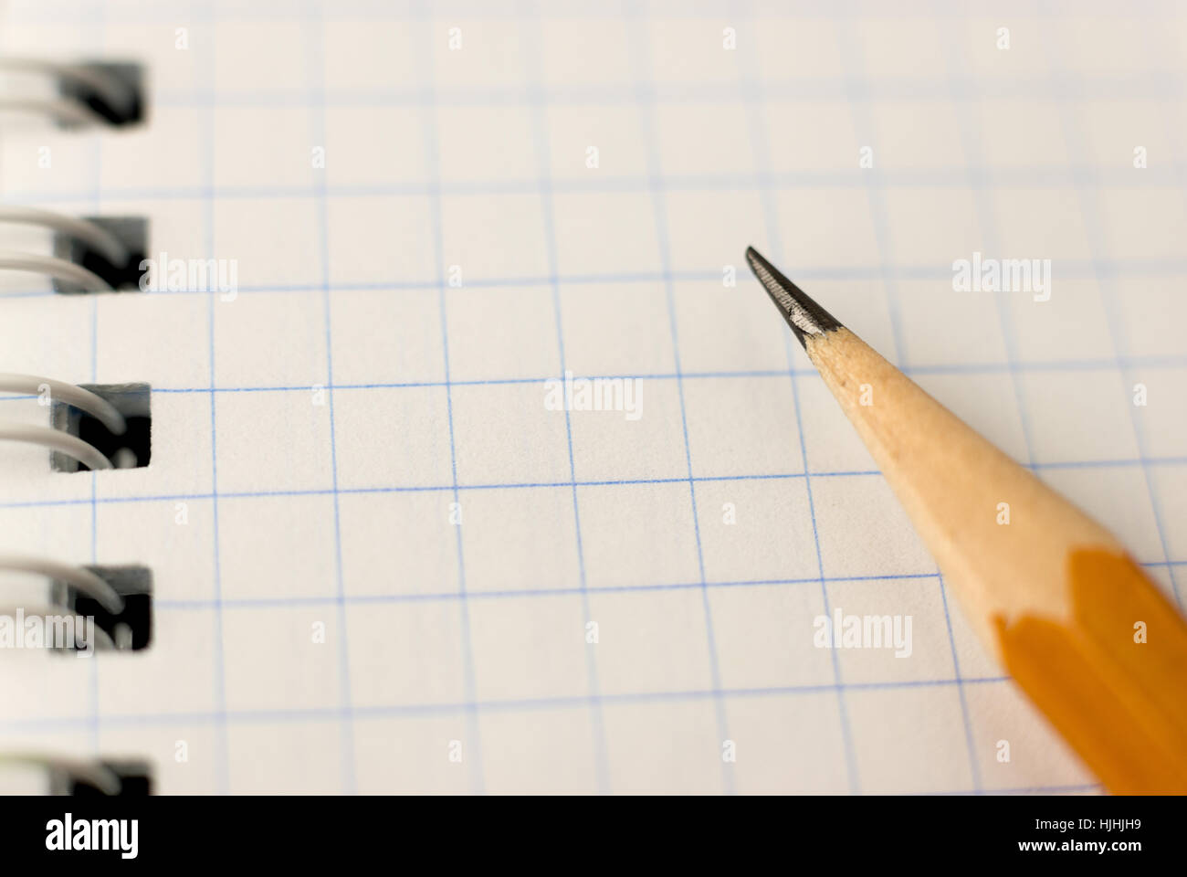 Pencil on the pages of an open notebook Stock Photo - Alamy