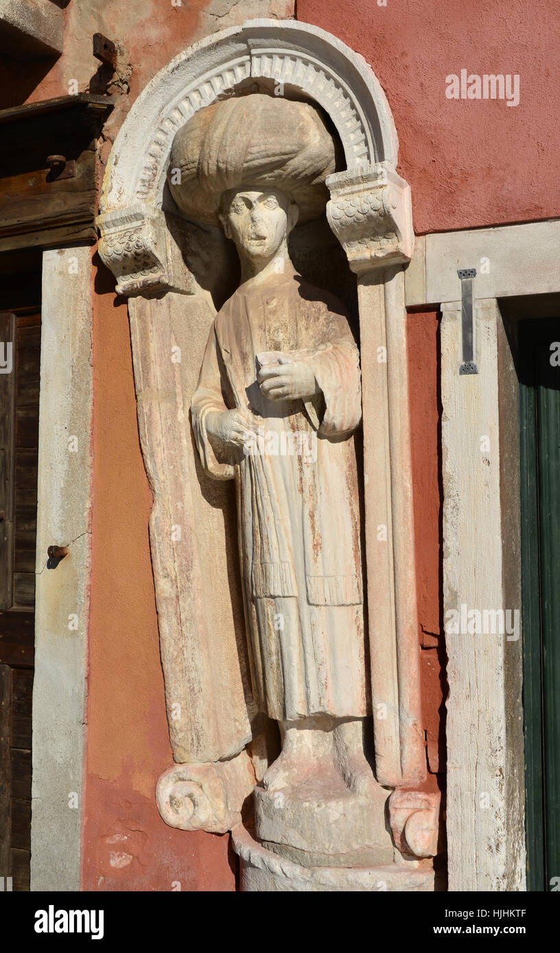 Muslim merchant medieval statue near Moorish Square in Venice Stock ...