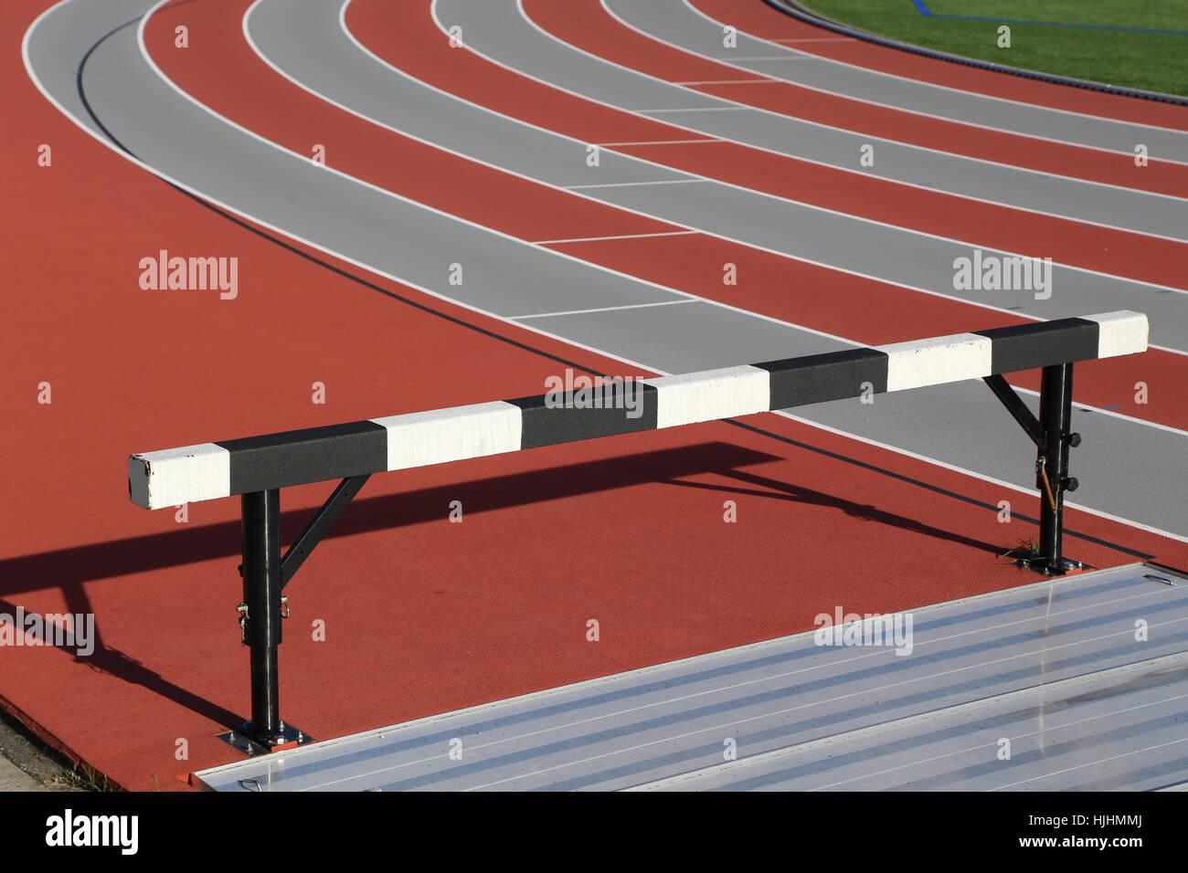 Track and athlete hurdling field Stock Photo - Alamy