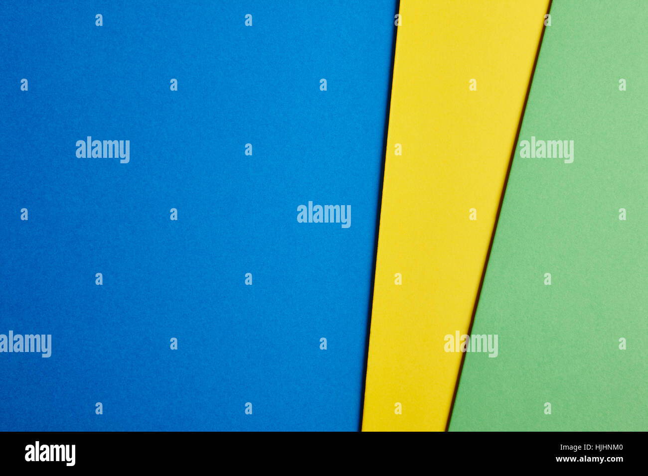 Colored cardboards background in blue yellow green tone. Copy space ...