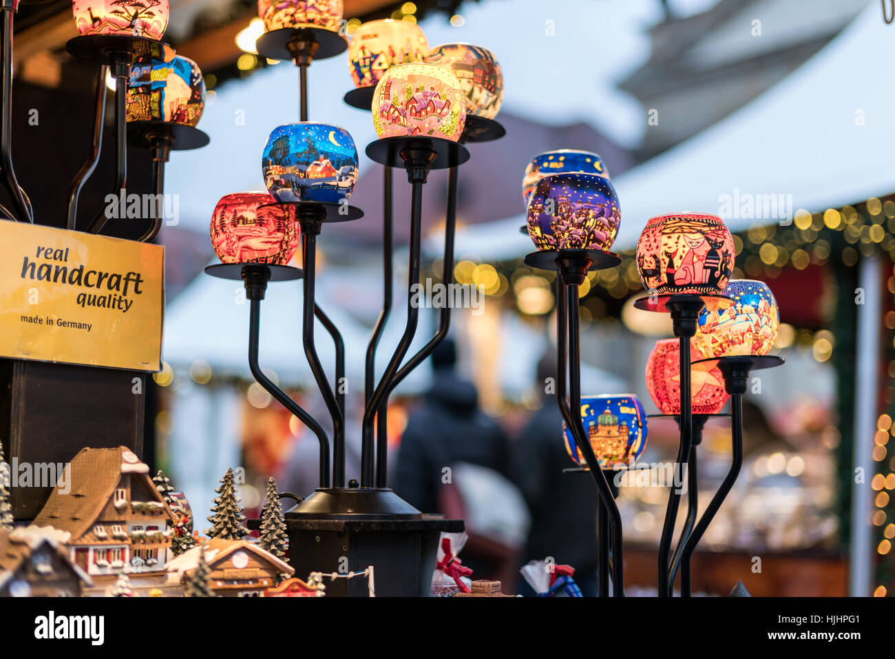 Handcrafted candle holders with colourful scenes on display at ...