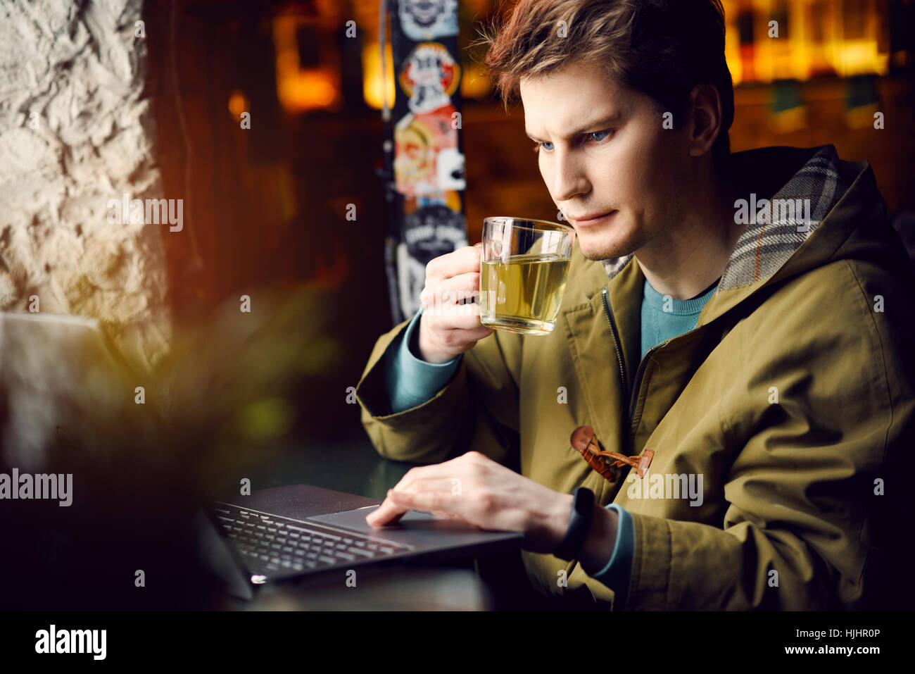 Guy drinking tea in cafe hi-res stock photography and images - Alamy