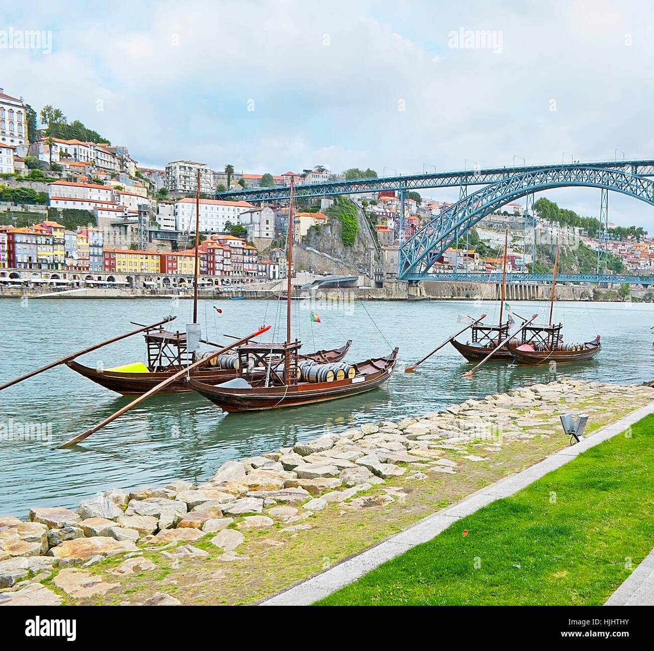 Traditional Rabelo boats laden with port wine barrels with the old ...