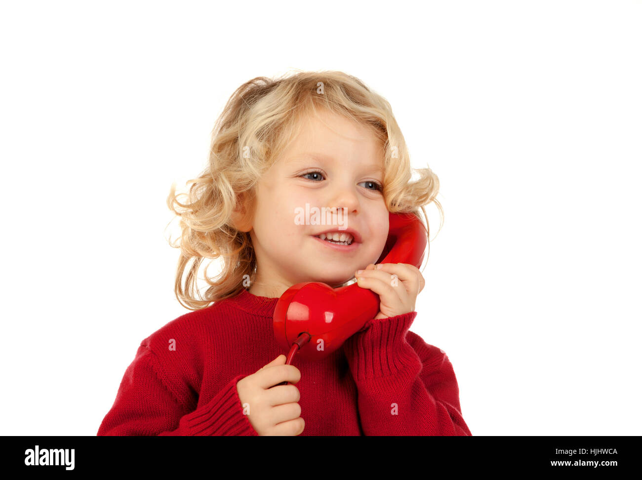 Funny little child talking on the phone isolated on a white background ...