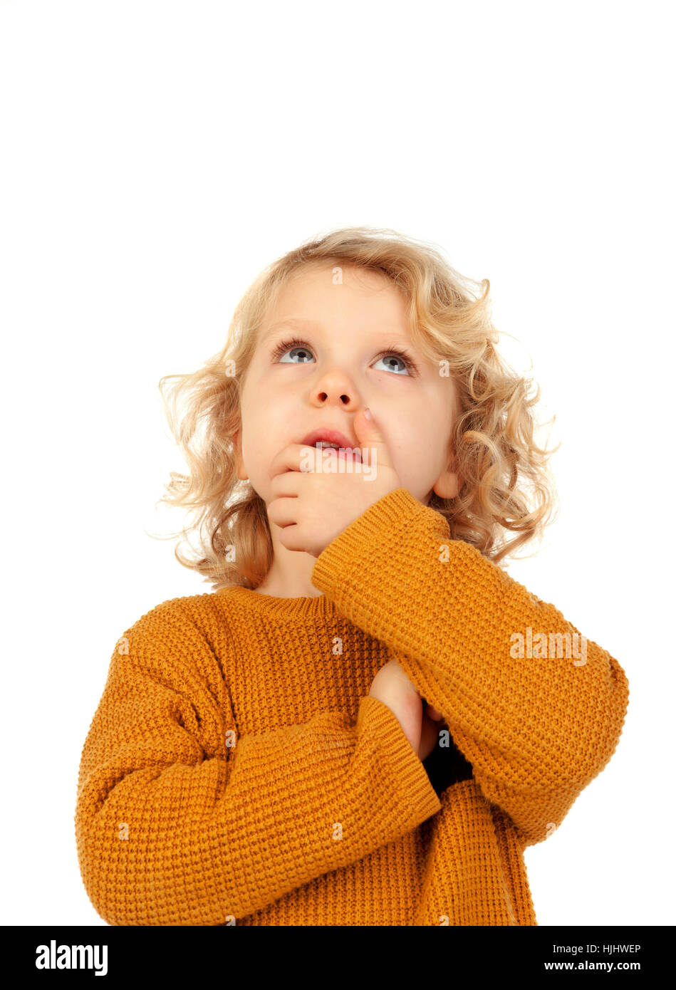 Small blond child imagining something isolated on a white background ...