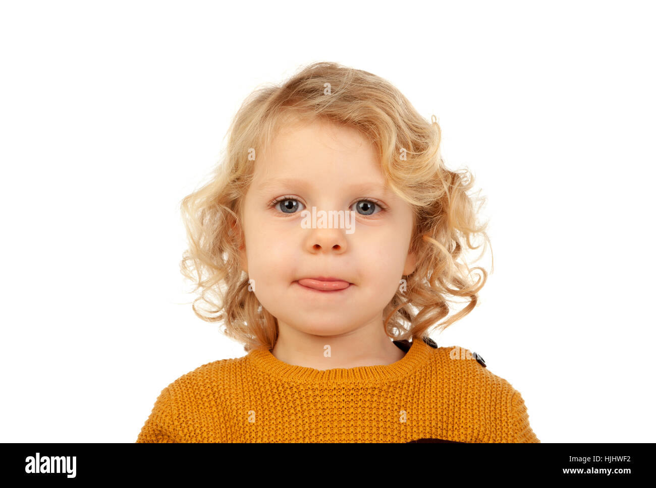 Portrait of playful small kid with long blond hair mockering isolated ...