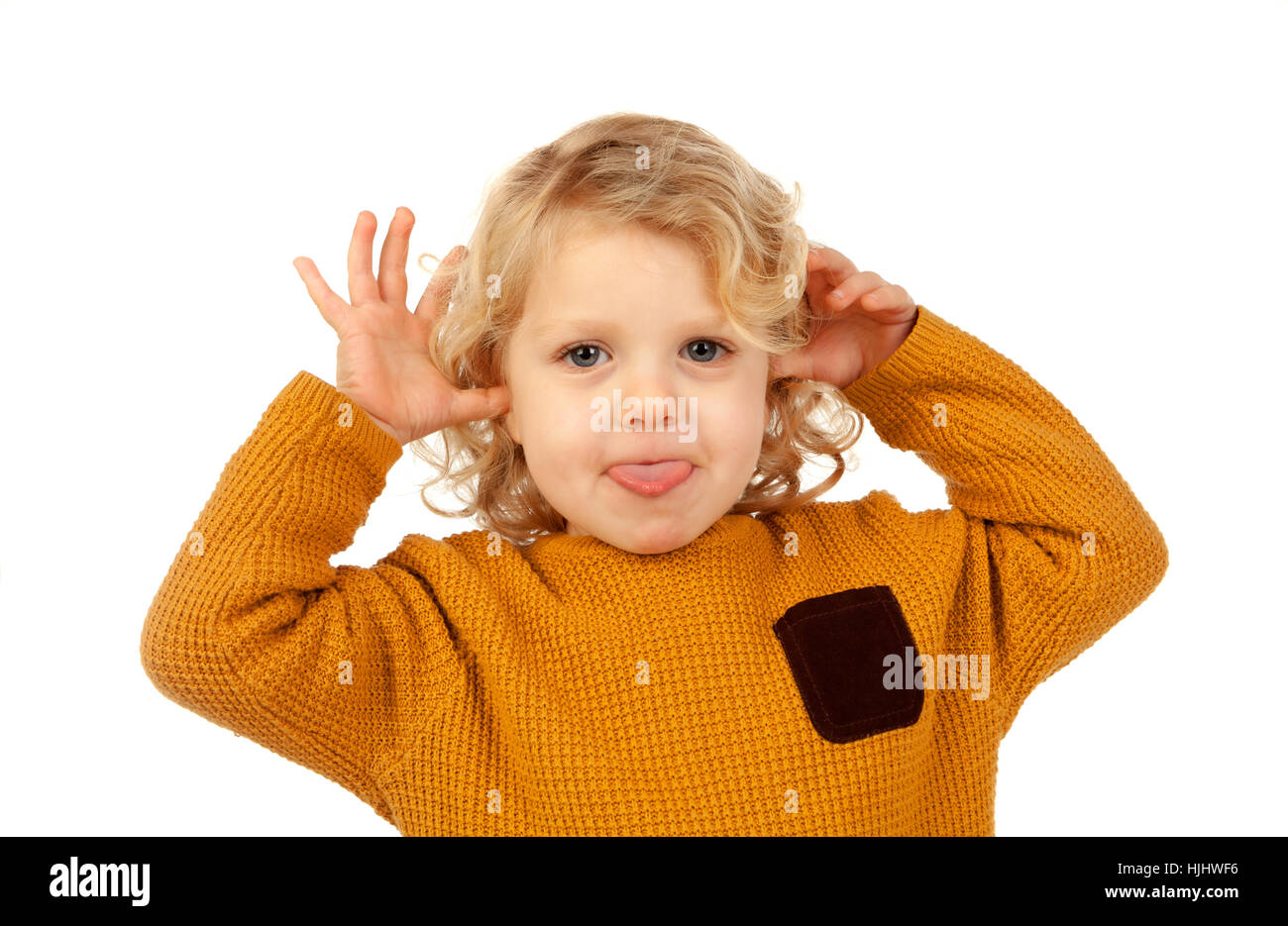 Portrait of playful small kid with long blond hair mockering isolated ...