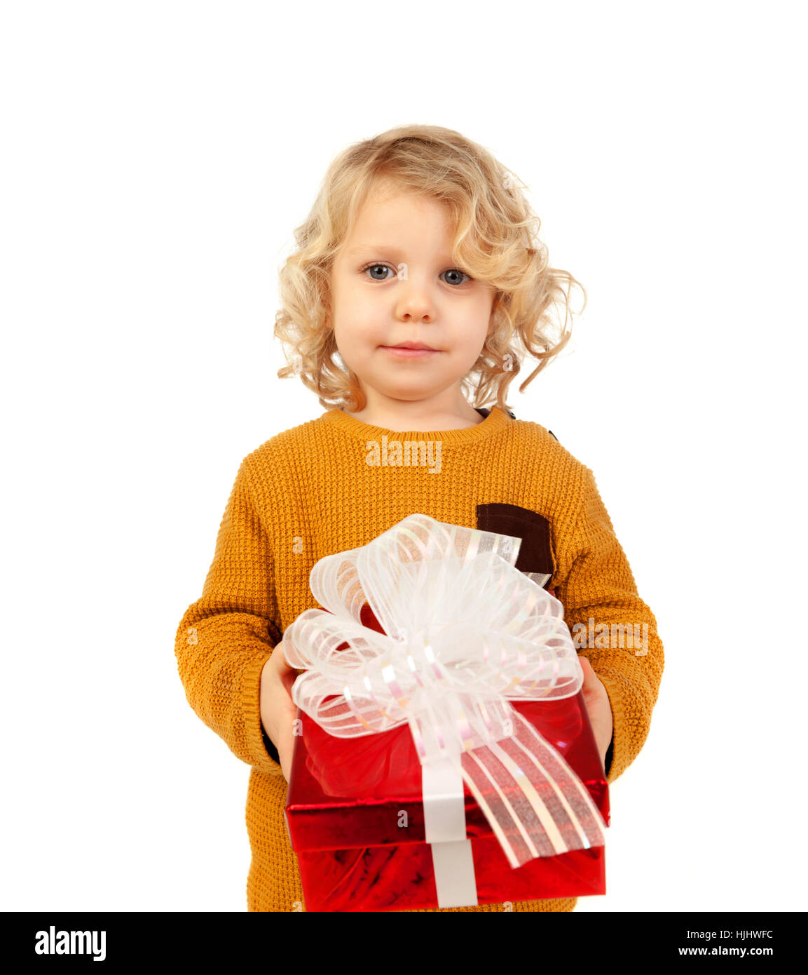 Small blond child with a red present isolated on a white background ...