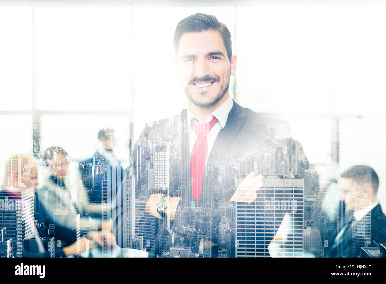 Team leader with coworkers working in modern office in NY Stock Photo ...