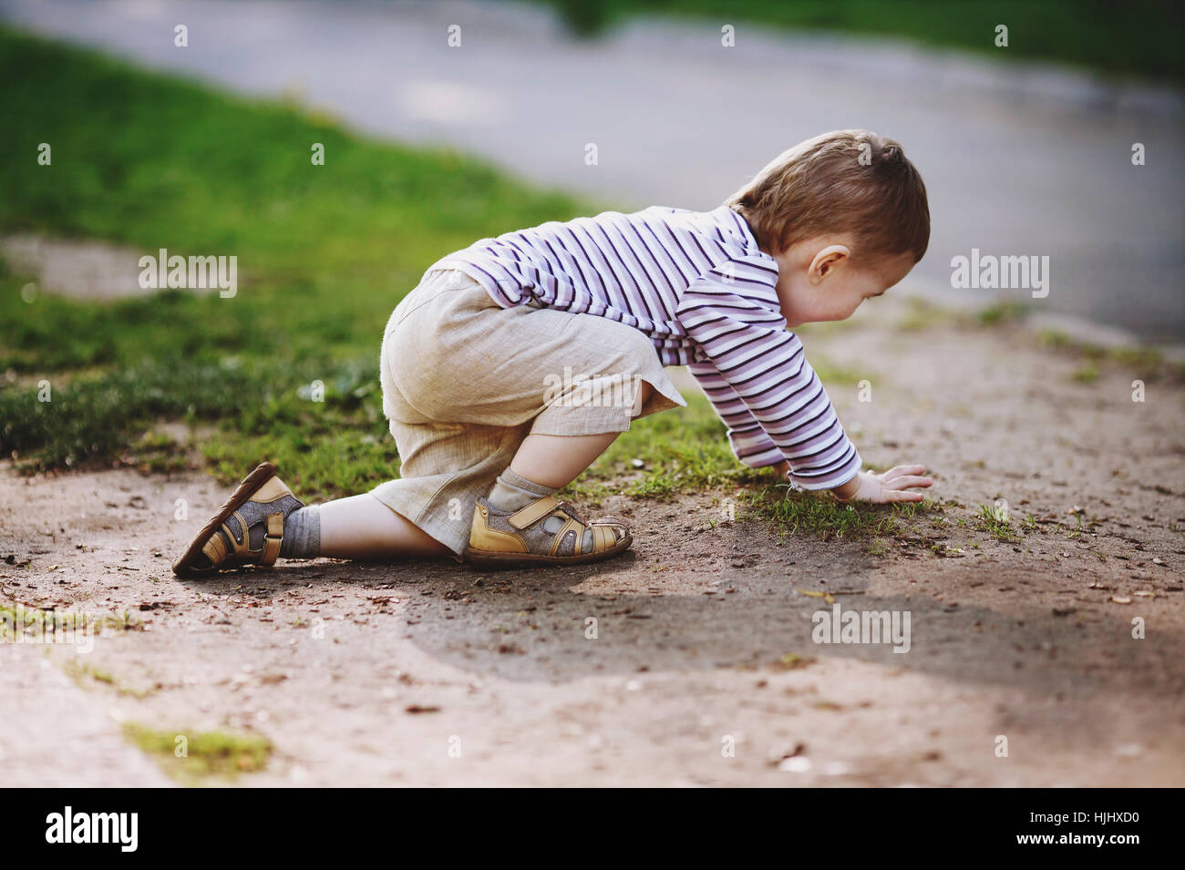 Young boy crawling on ground hi-res stock photography and images - Alamy