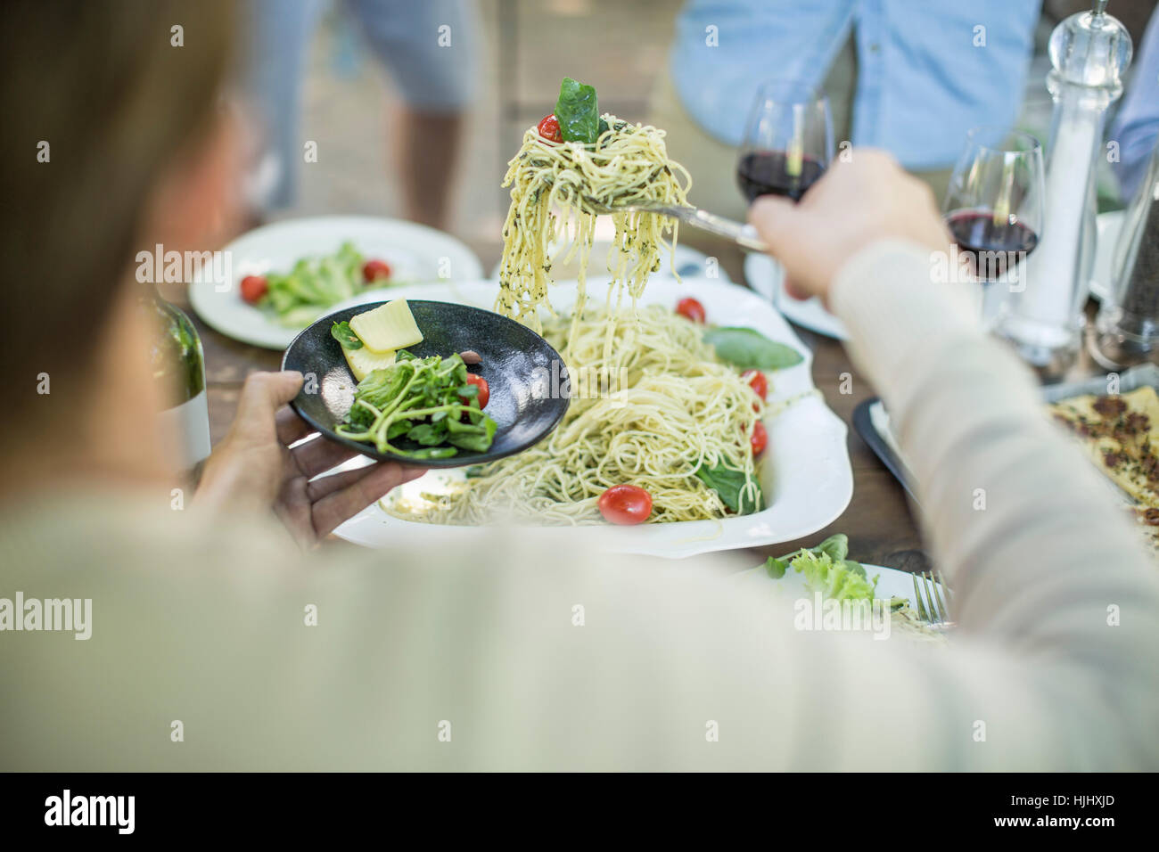 Eating spaghetti for lunch in garden Stock Photo - Alamy